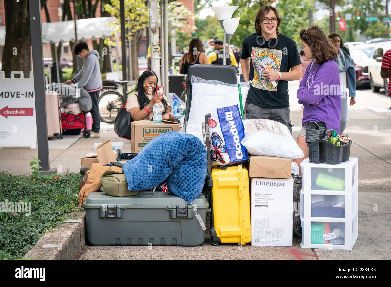 Noah Decker, center, with his sister Charlotte Decker, right, as they ...