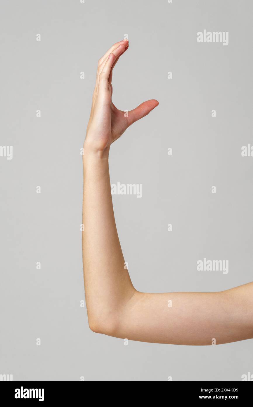 Close Up of a Woman's Arm Extended Upward Stock Photo - Alamy