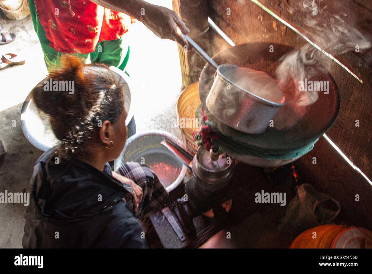 Chauri milk is boiled and churned using a modern churner that produces ...