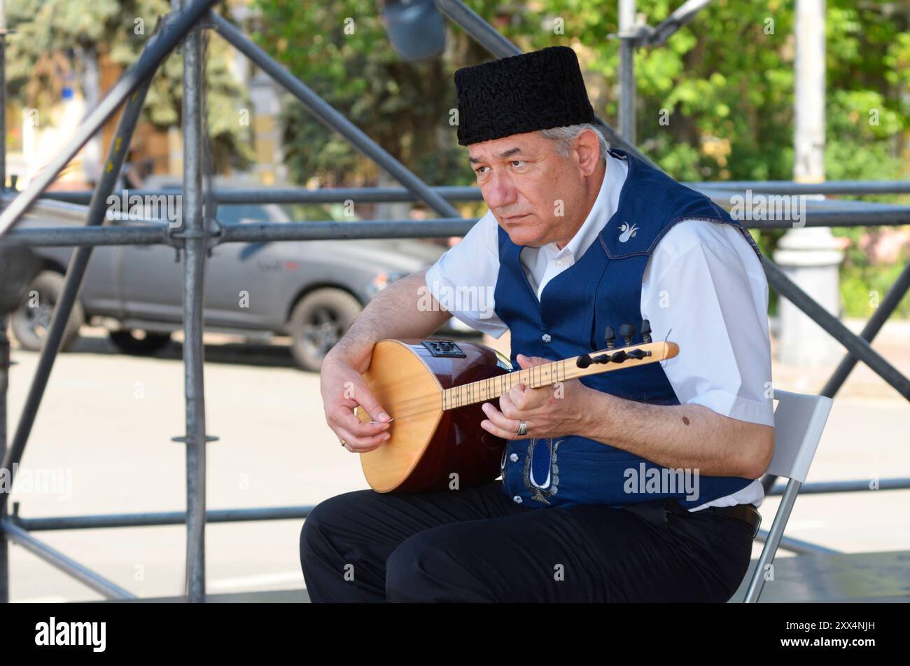Famous Crimean Tartar musician Jemil Karikov playing national string ...