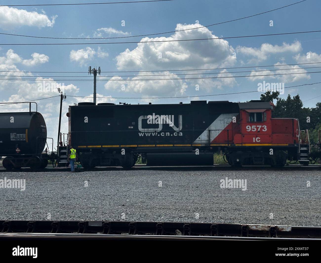 A railwayman inspects the locomotive of a Canadian National Railroad ...