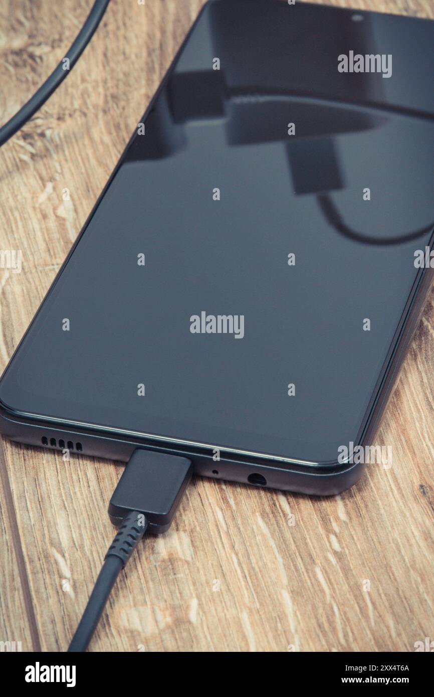Smartphone and connected cable of charger. Mobile phone charging Stock ...
