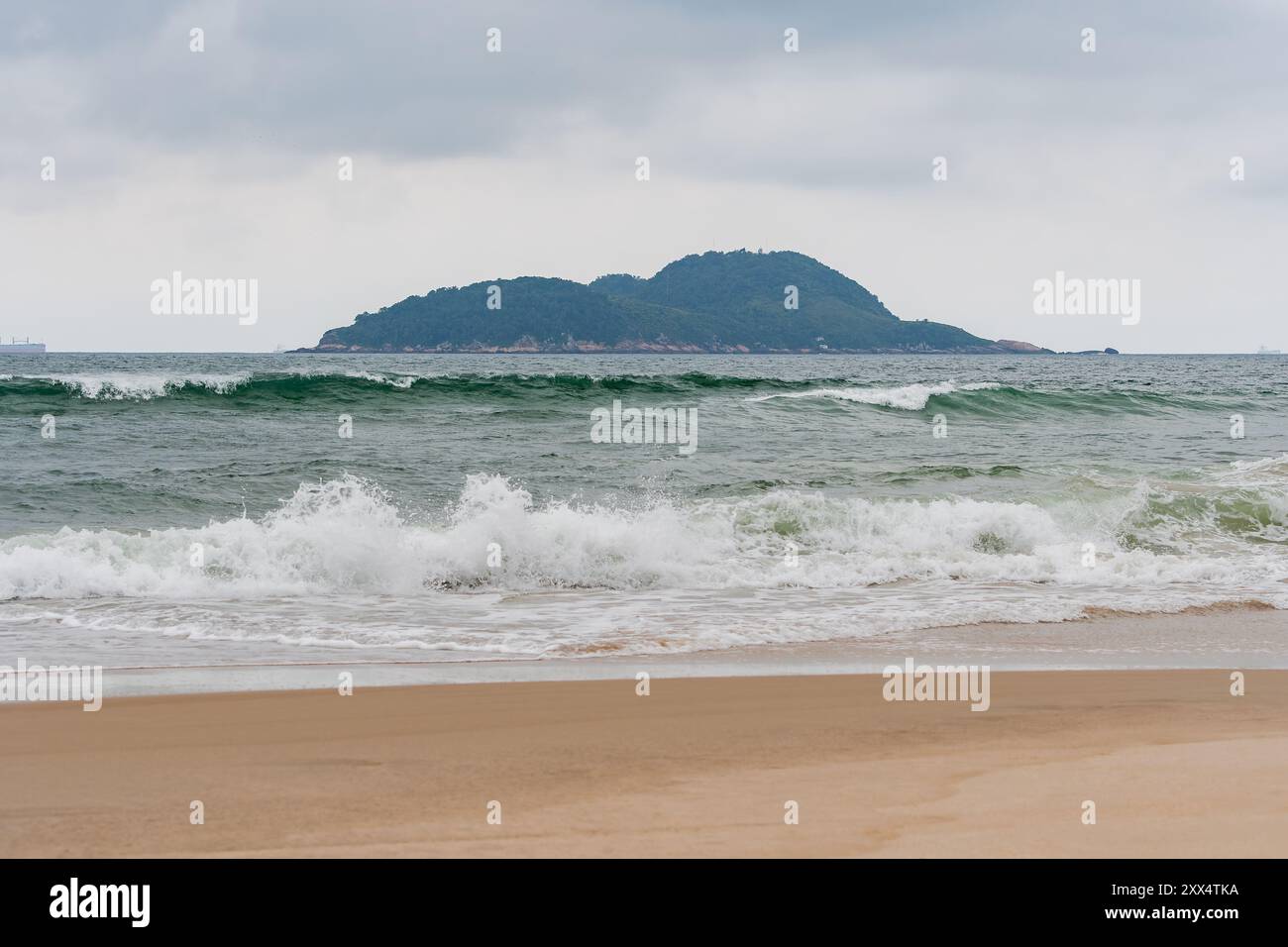 The Tombo beach of Guaruja - SP, Brazil with the Farol da Moela island ...