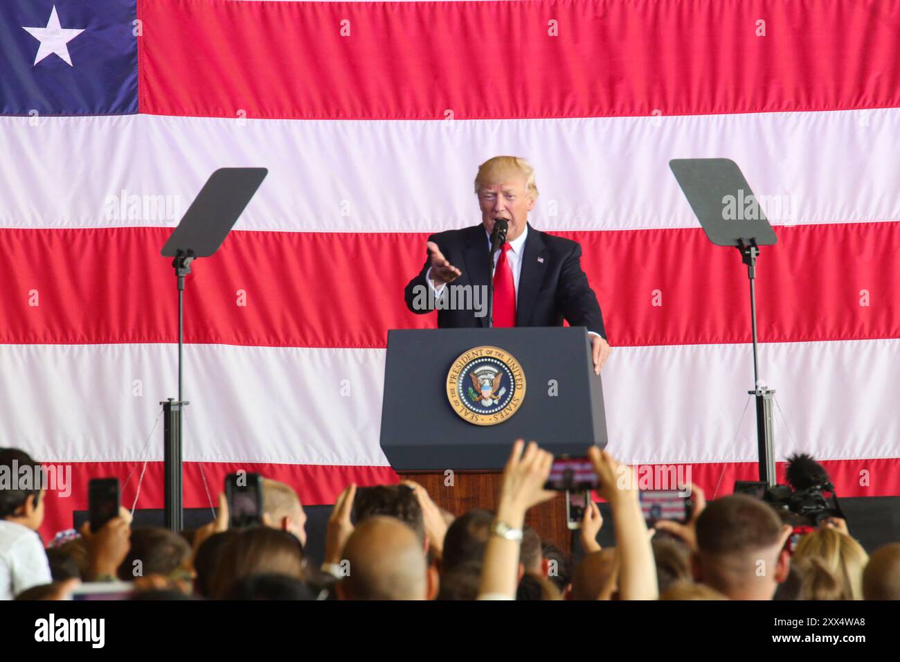 President Donald Trump speaks to U.S. service members and their ...