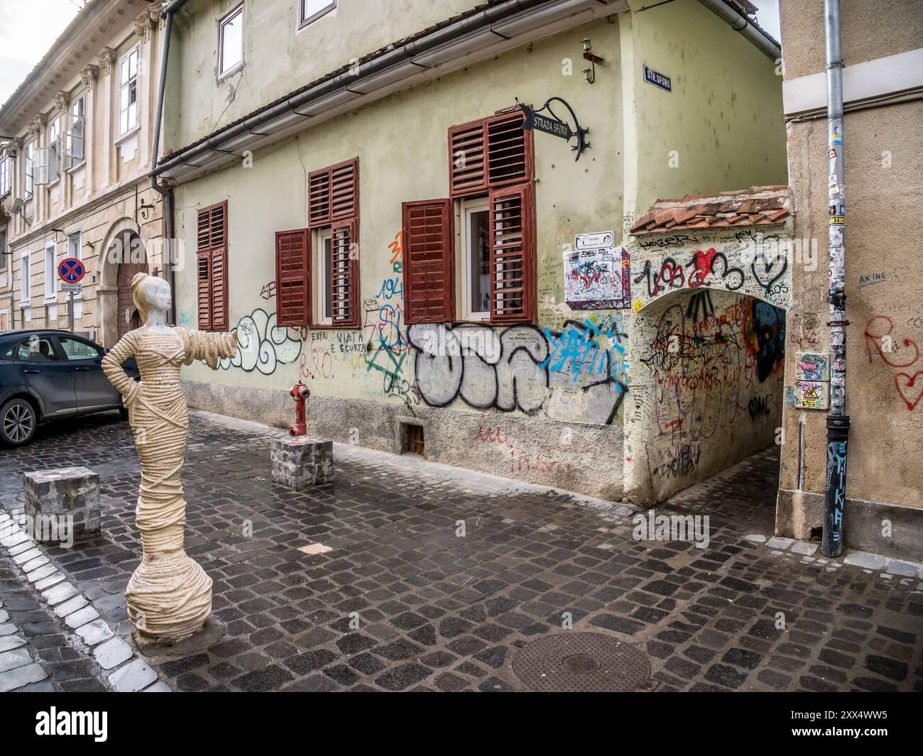 The Rope Lady Statue at the Entrance to Strada Sforii, Brasov, Romania ...