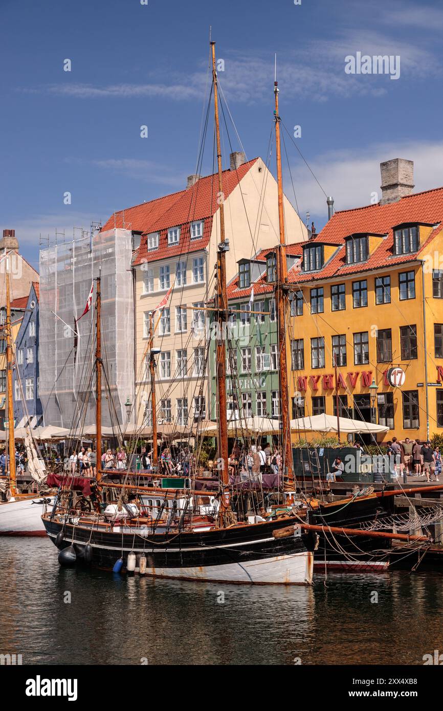Colourful waterfront buildings and boats at Nyhavn, Copenhagen, Denmark ...