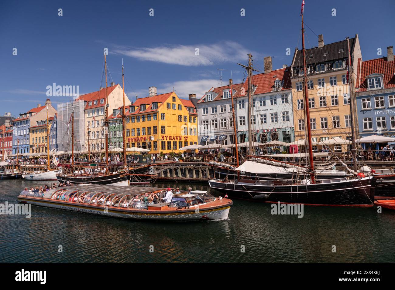 Colourful waterfront buildings and boats at Nyhavn, Copenhagen, Denmark ...