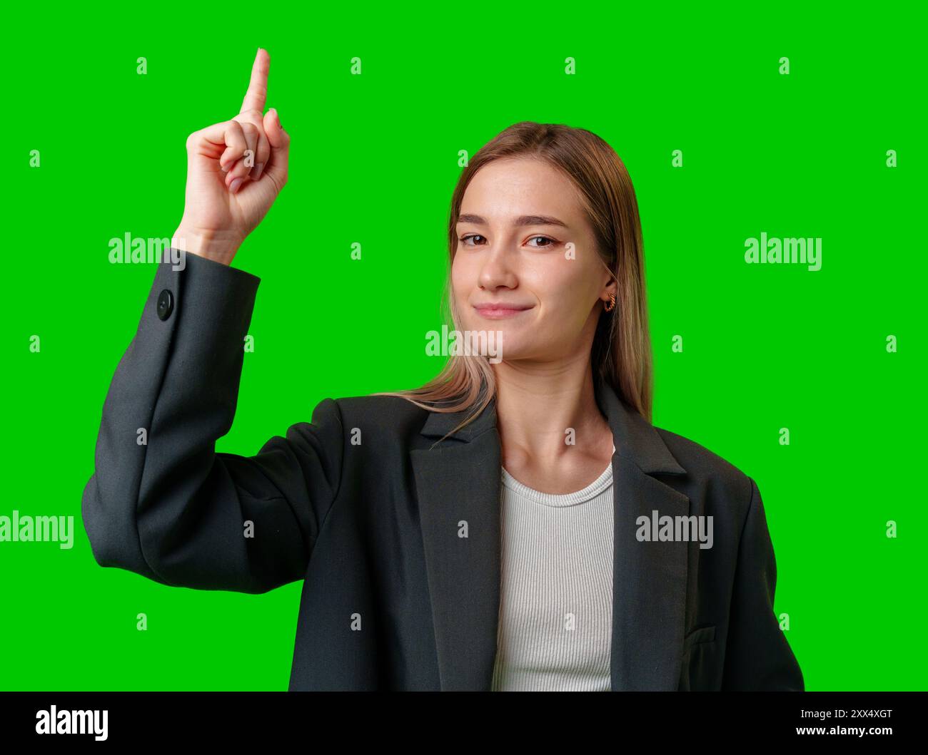 Woman in black jacket points hi-res stock photography and images - Alamy