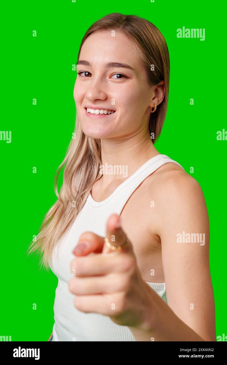 Woman in White Tank Top Pointing at Camera Stock Photo - Alamy