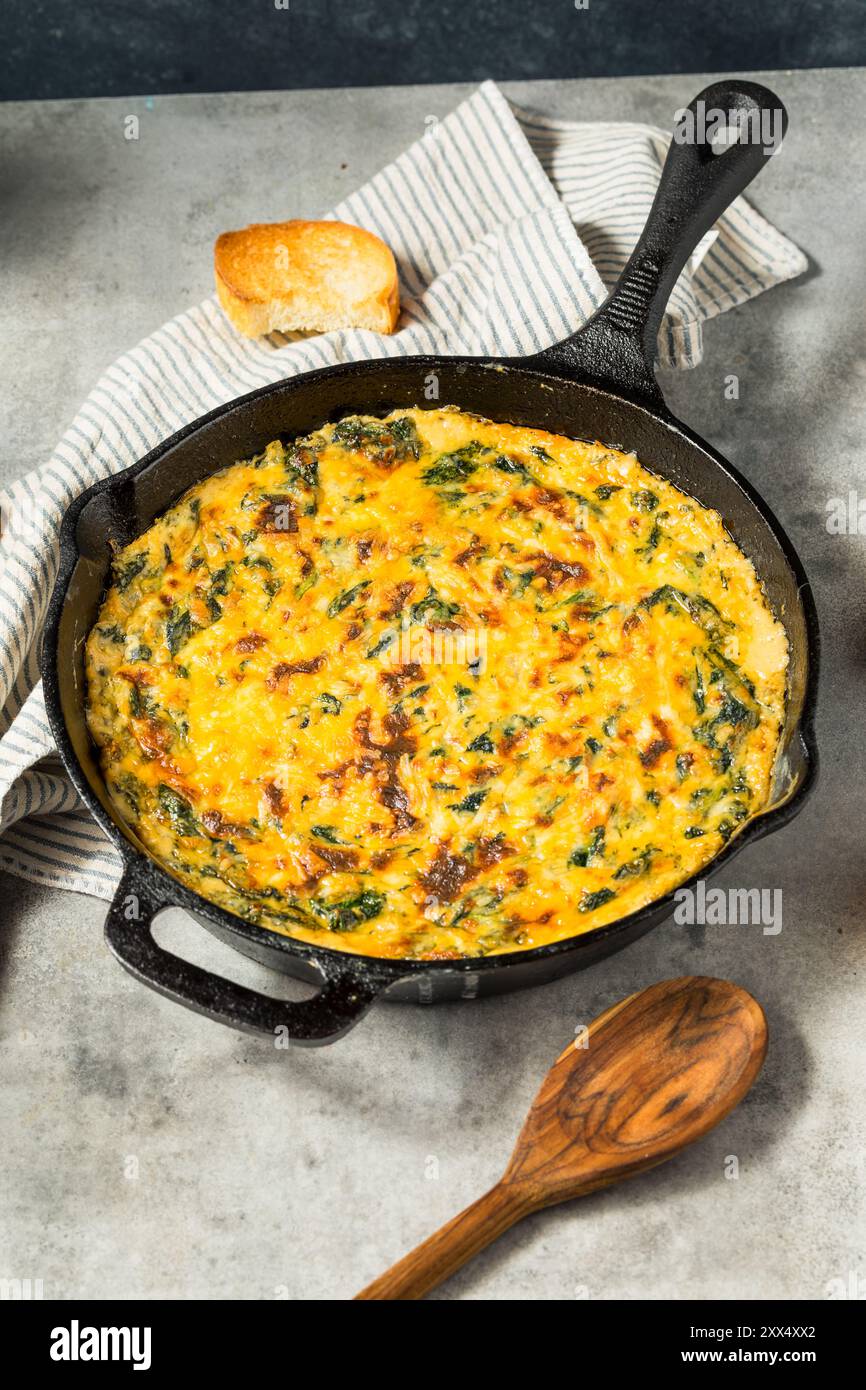 Healthy Baked Spinach Maria Dip with Cheese and Toast Stock Photo - Alamy