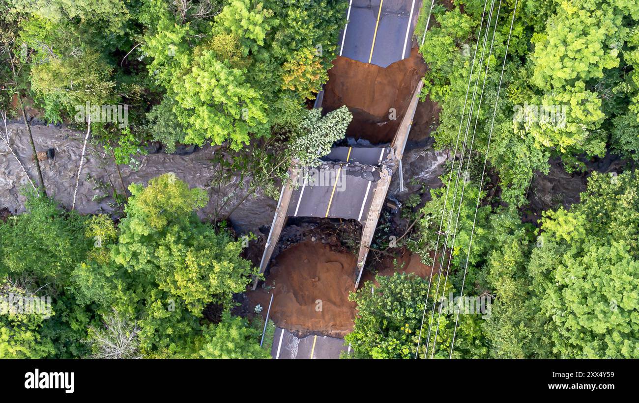 Aerial view of road and bridge destroyed by the heavy rain and flood ...