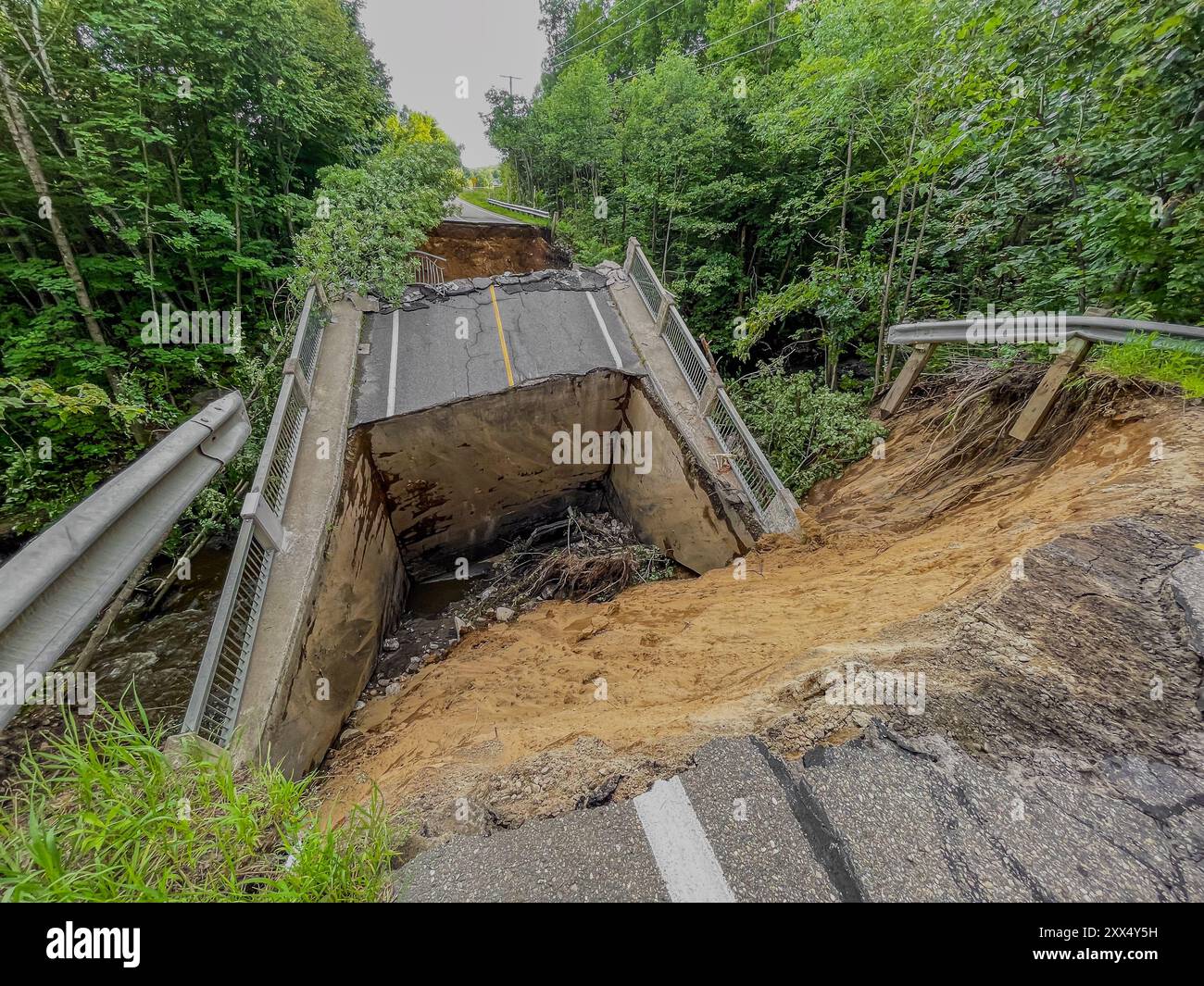 Closeup view of road and bridge destroyed by the heavy rain and flood ...
