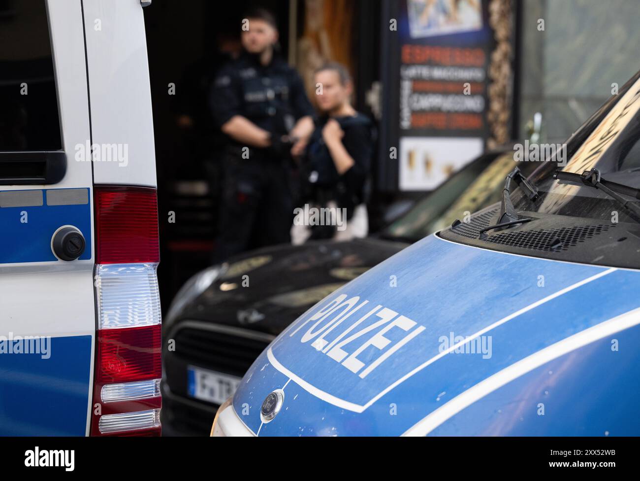 22 August 2024, Hesse, Frankfurt/Main: Police officers stand at the ...