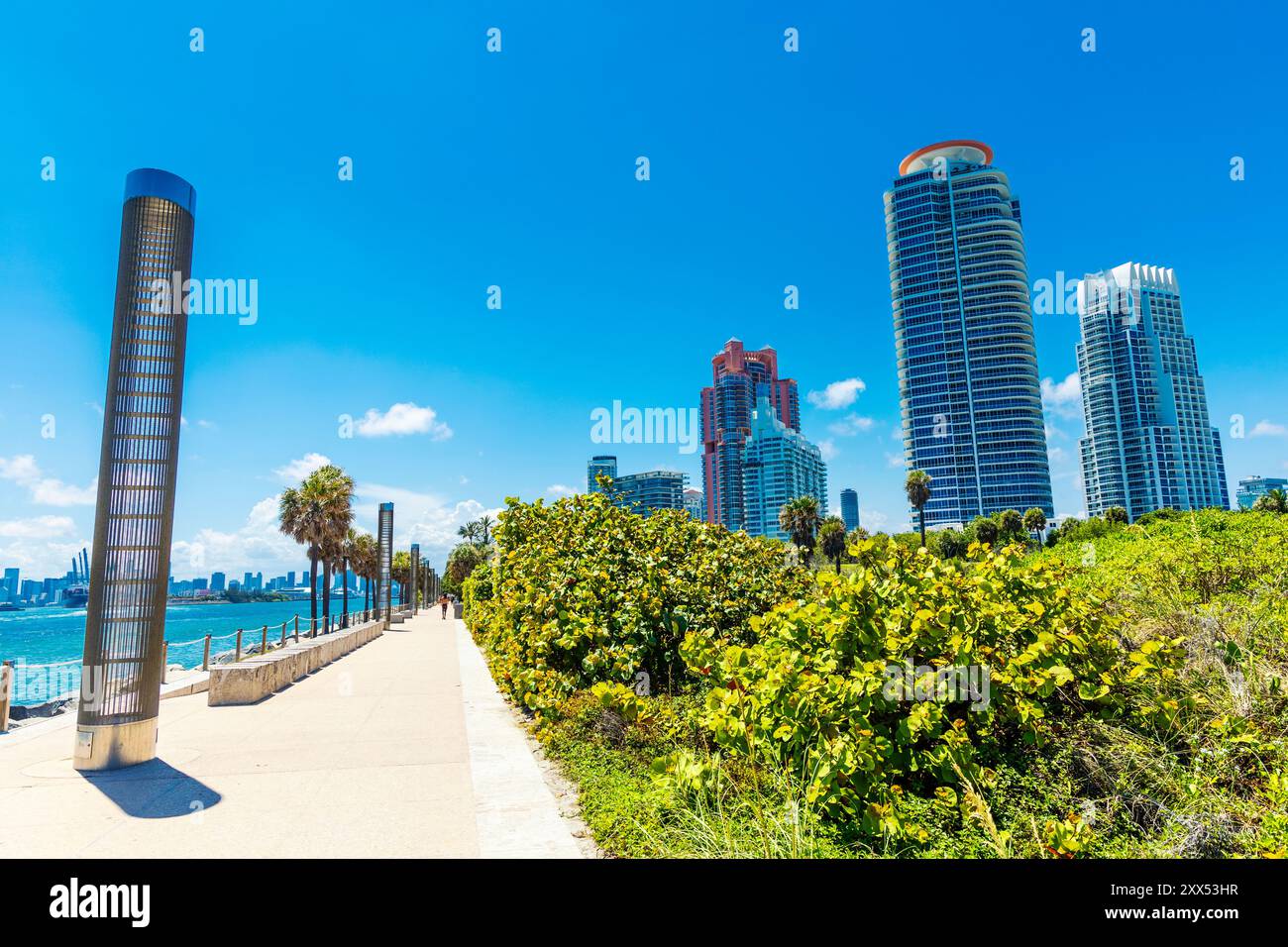 Boardwalk along South Pointe Park and two towers of Continuum On South Beach apartment complex ...