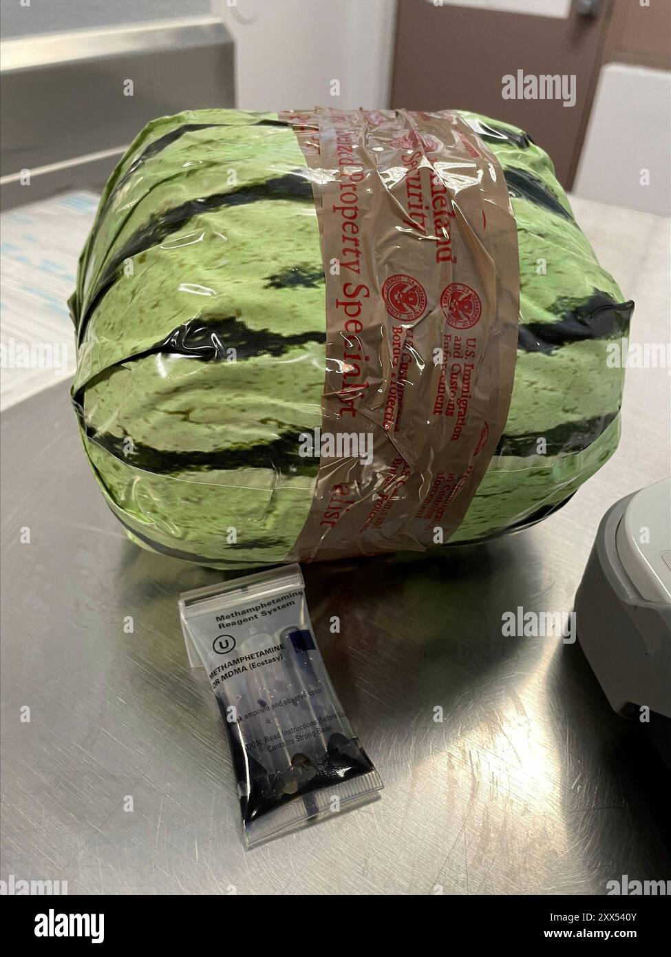 A fake watermelon, used to disguised a shipment of methamphetamines, is ...