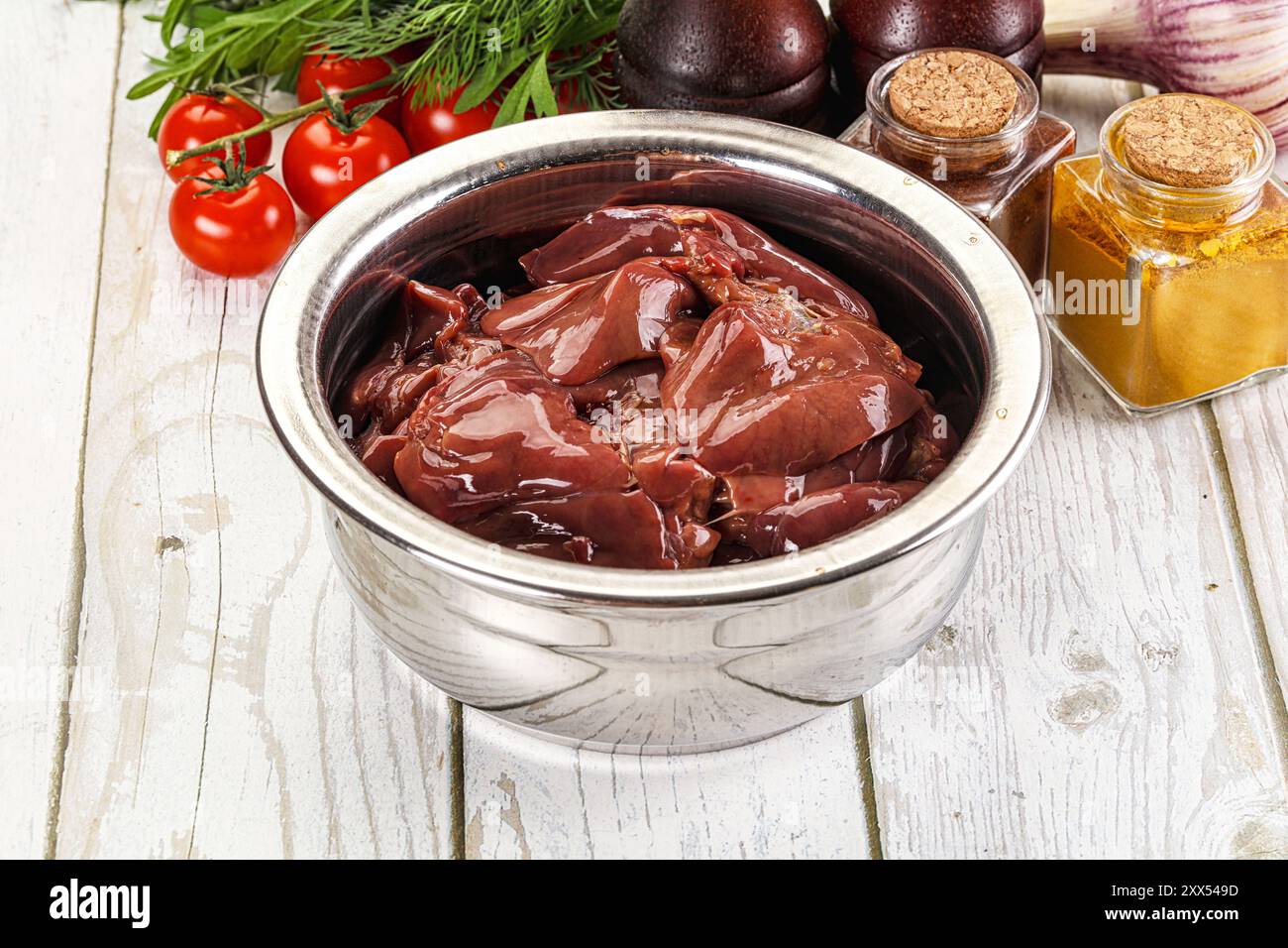 Raw chicken liver uncooked in the bowl with spices Stock Photo - Alamy