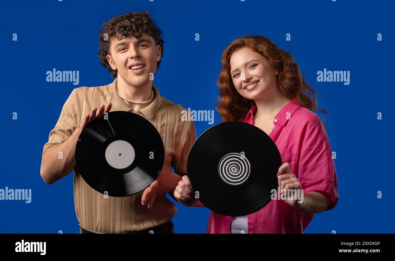 Funny couple - man woman dancing with vinyl records disc. Hobby, music ...