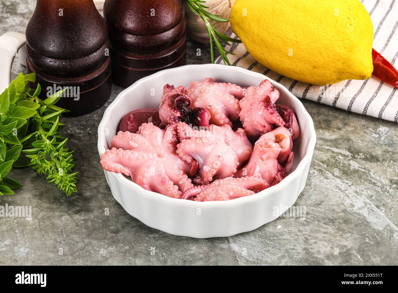 Marinated baby octopus snack appetizer served lemon Stock Photo - Alamy