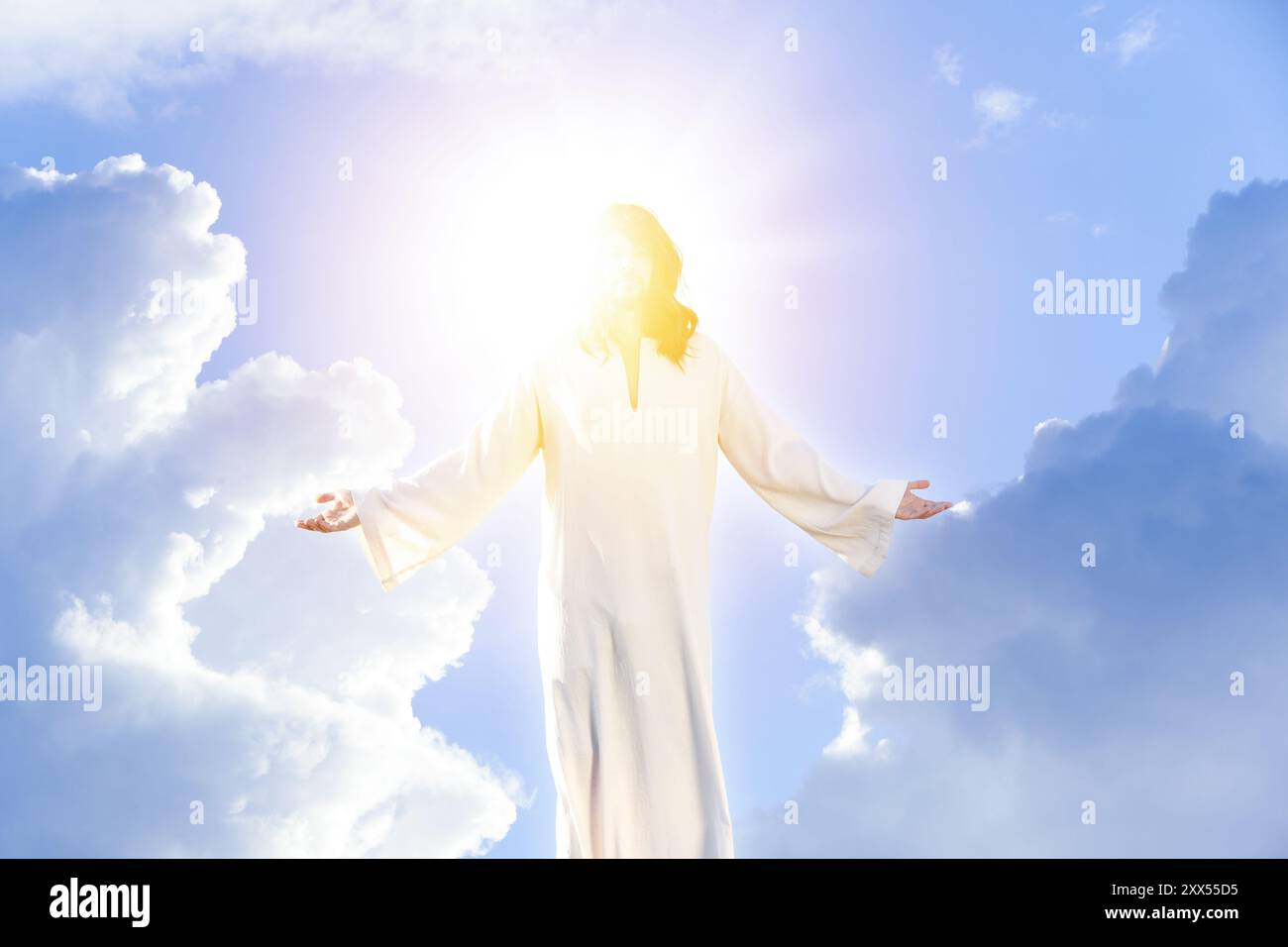 Jesus Christ in sunlight among clouds in sky Stock Photo - Alamy