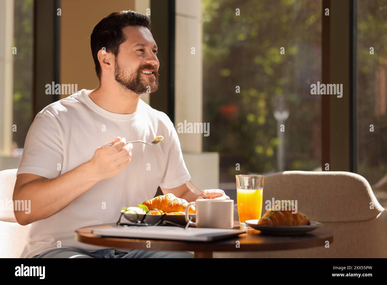 Man having breakfast alone in hi-res stock photography and images - Alamy