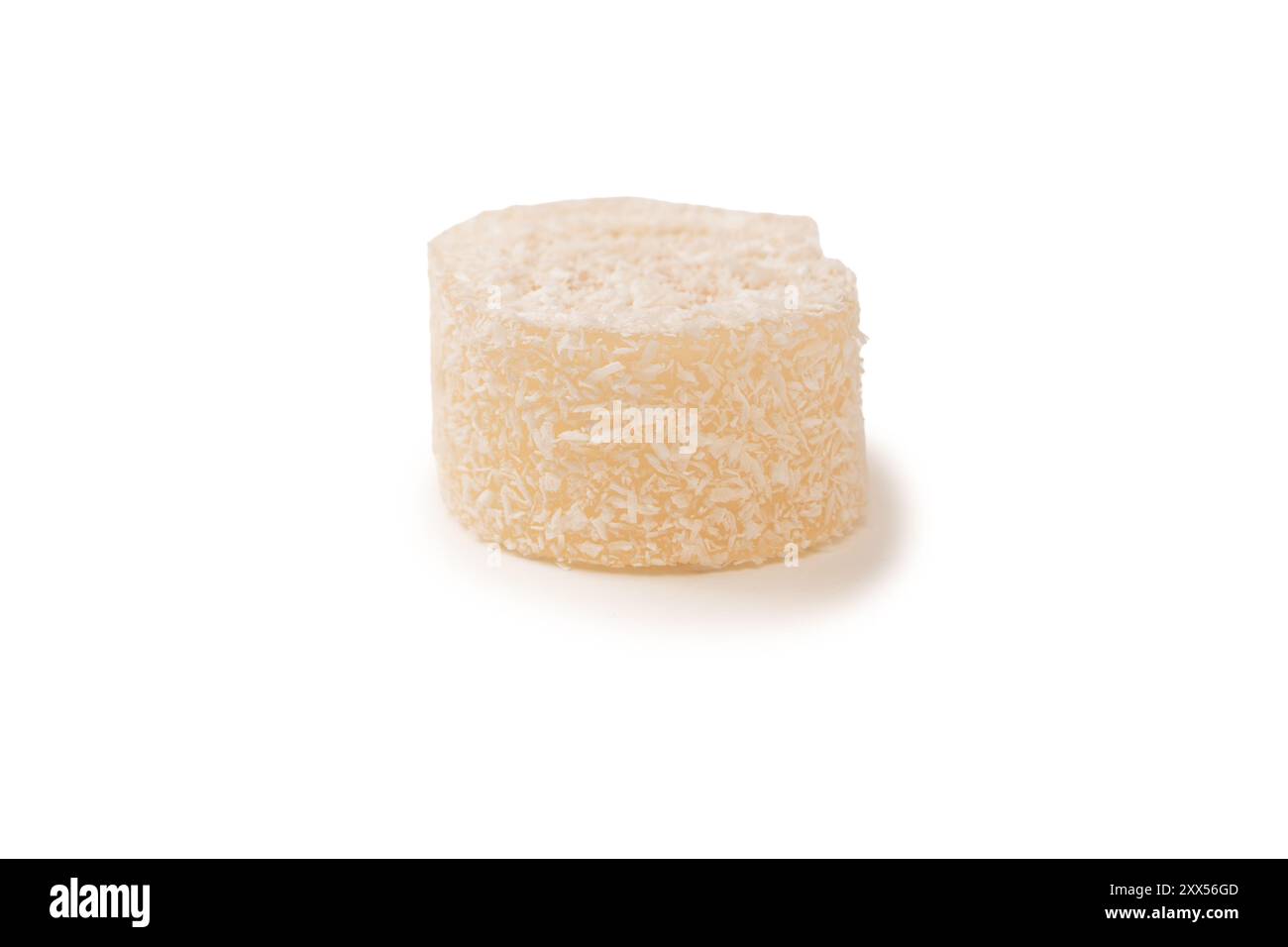 Coconut candy roll isolated on a white background Stock Photo - Alamy