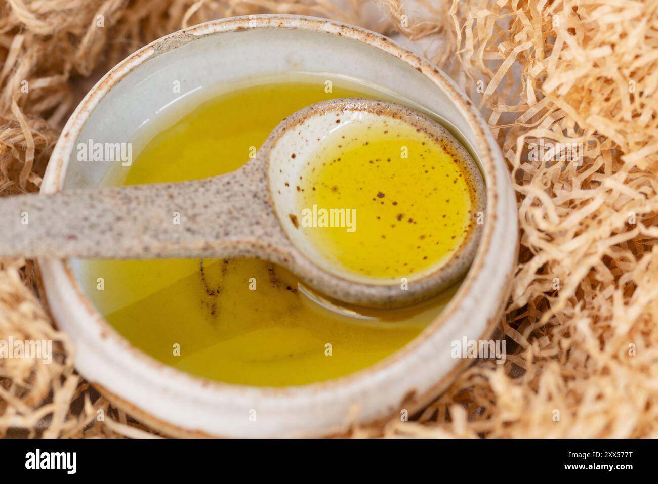 Ceramic Spoon With Olive Oil Stock Photo - Alamy