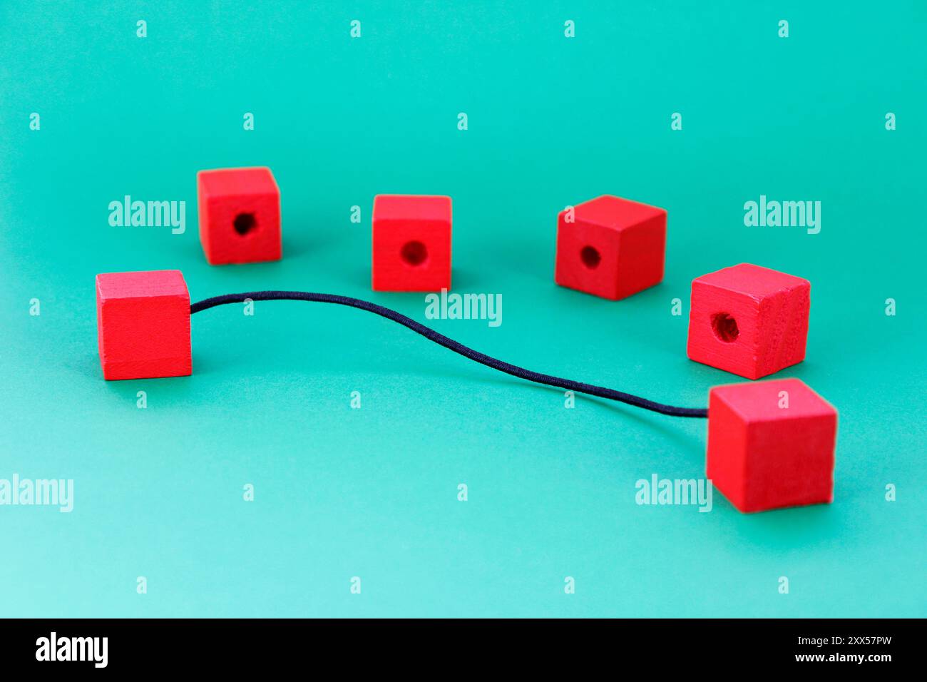 Wooden cubes, leaders forming a team Stock Photo - Alamy