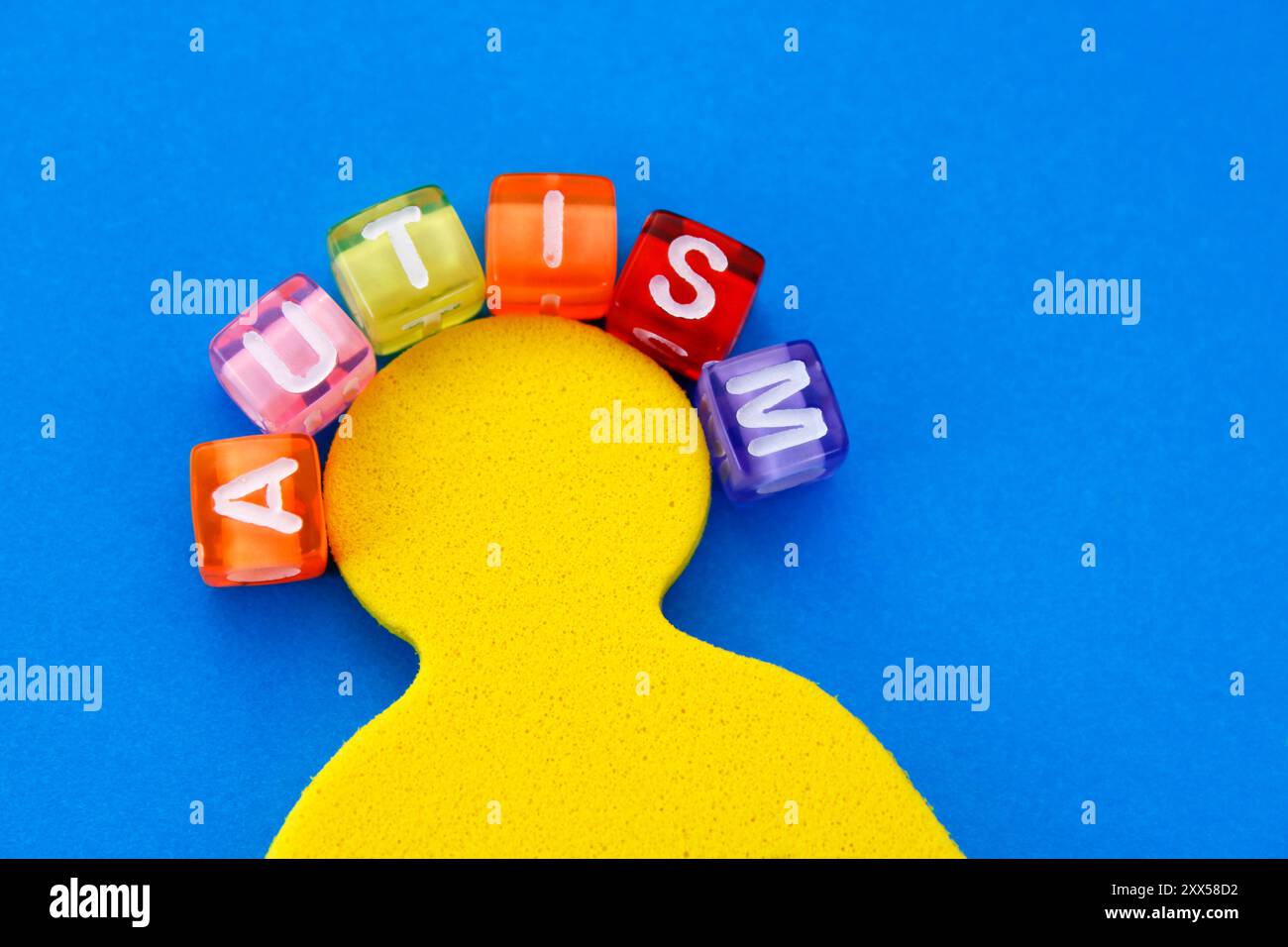 Autism, head silhouette surrounded by colorful cubes Stock Photo - Alamy