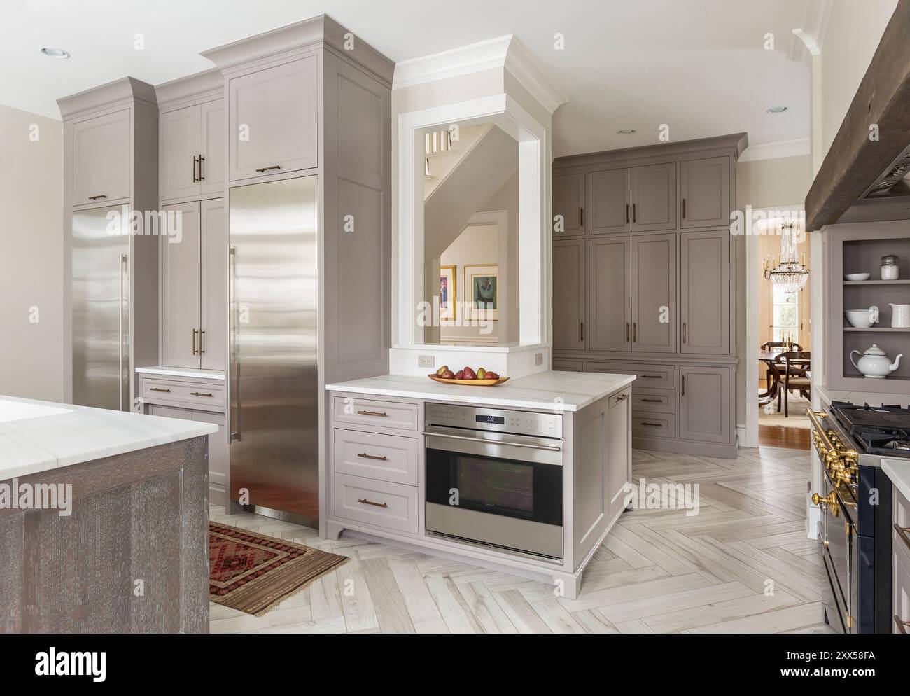 Elegant kitchen showing two column refrigerators and unique corner pass ...