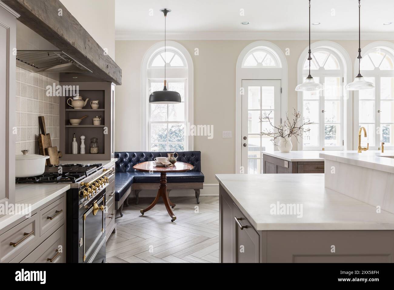View of elegant beige and white kitchen showing La Cornue stove and ...