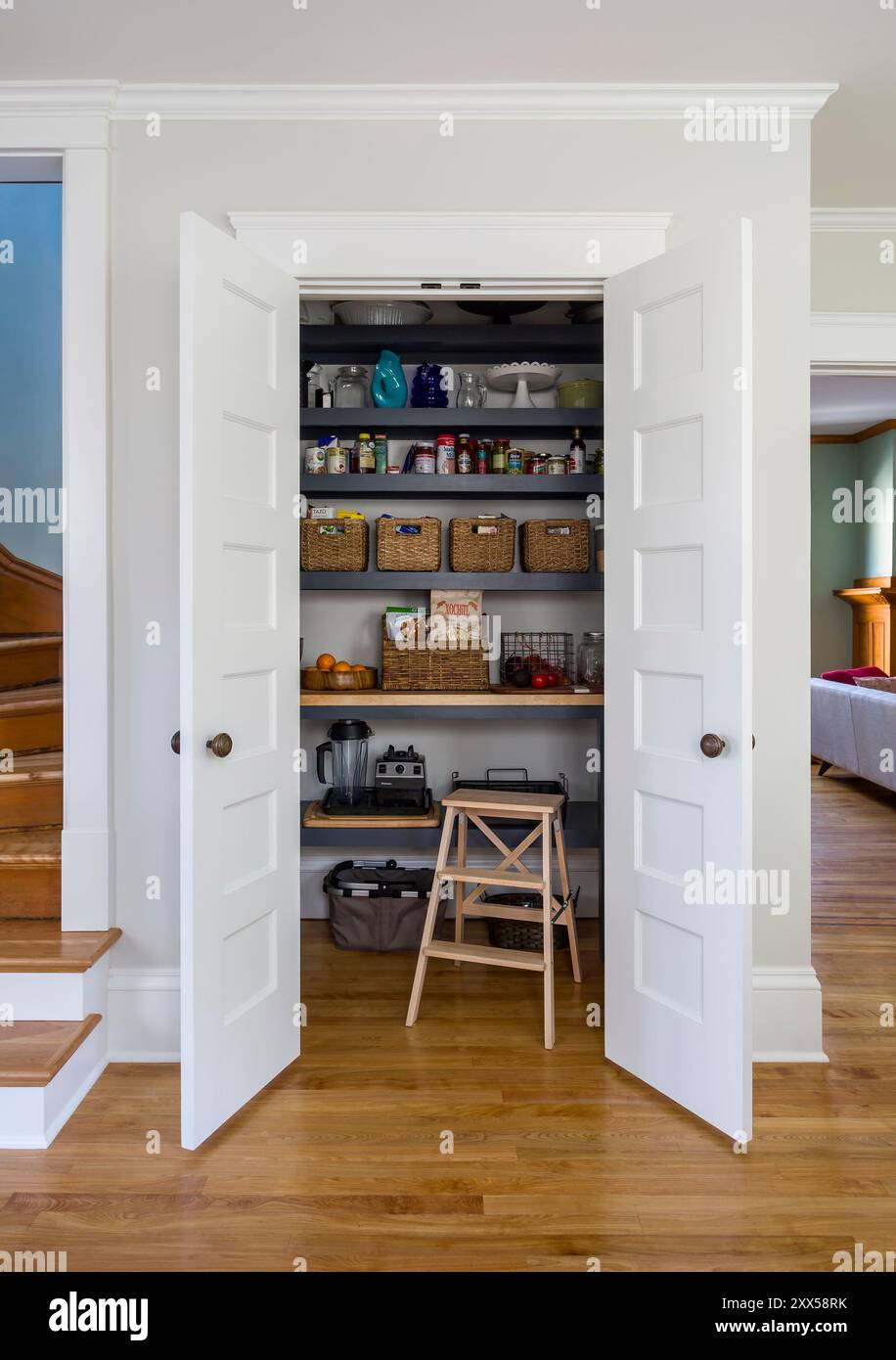 Double doors open up to reveal kitchen pantry Stock Photo - Alamy