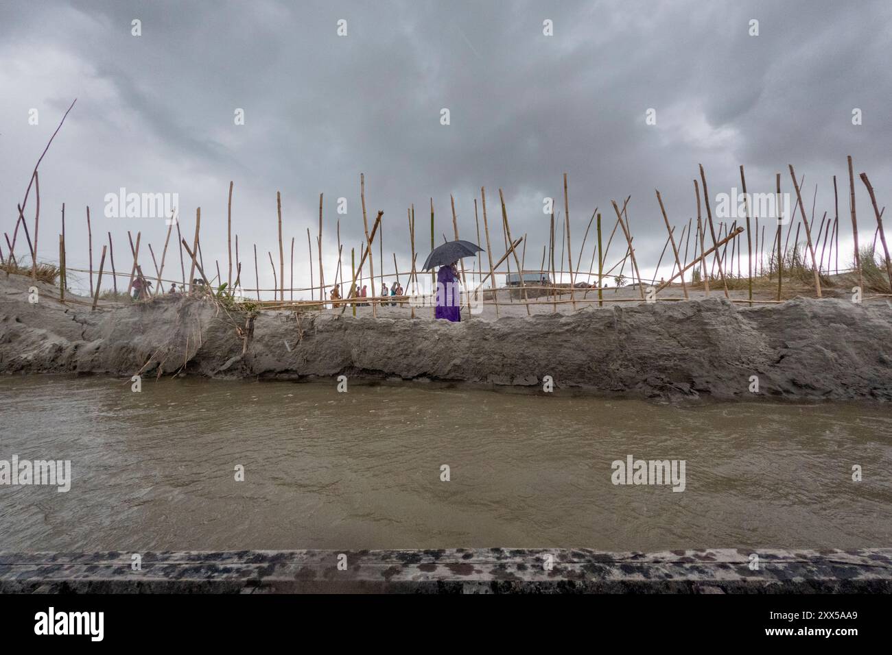 Rashed paddles his country boat alongside the villagers on the Kheyar ...