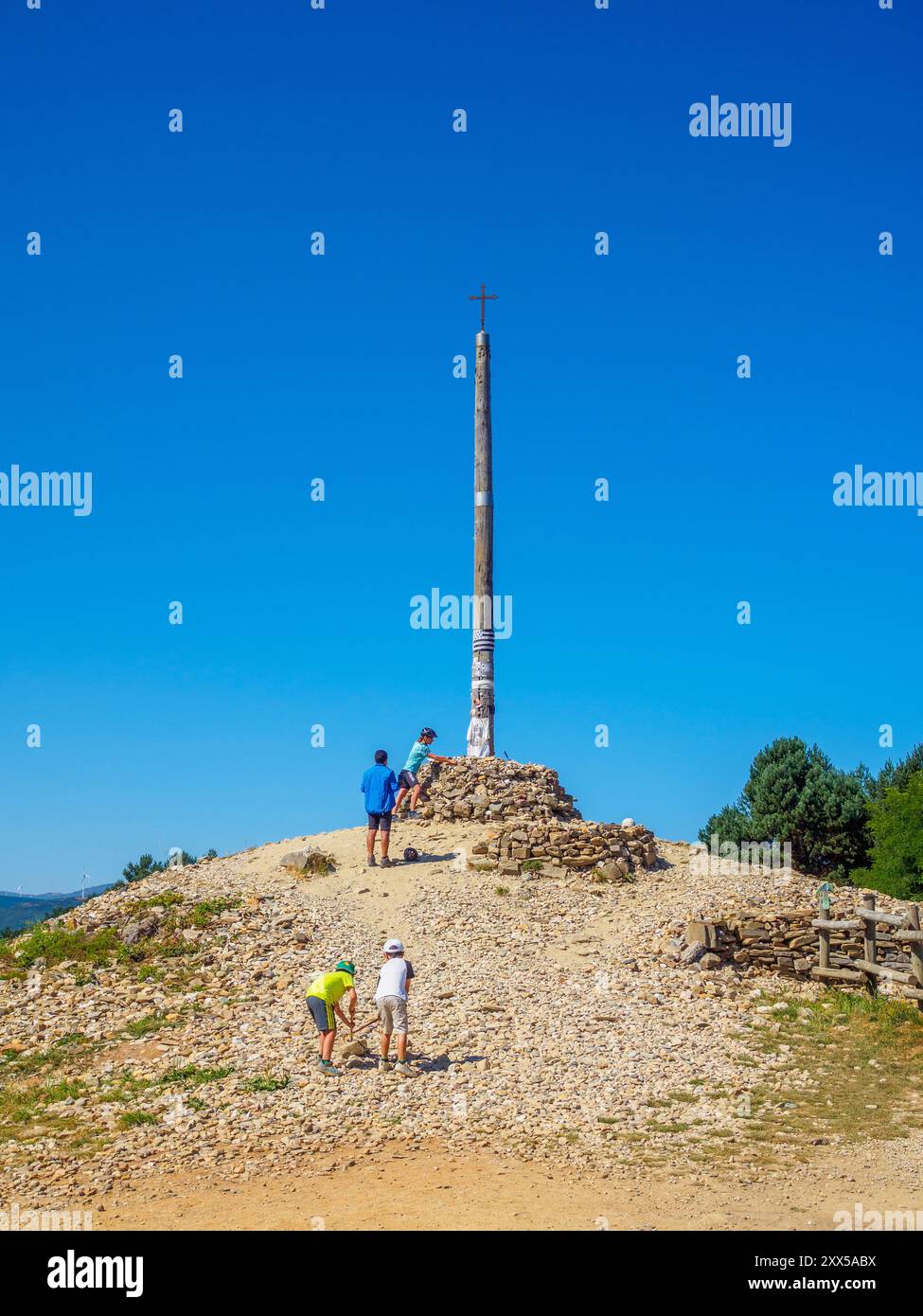 The iconic Cruz de Ferro, a significant landmark on the Camino de Santiago, near Foncebadon ...