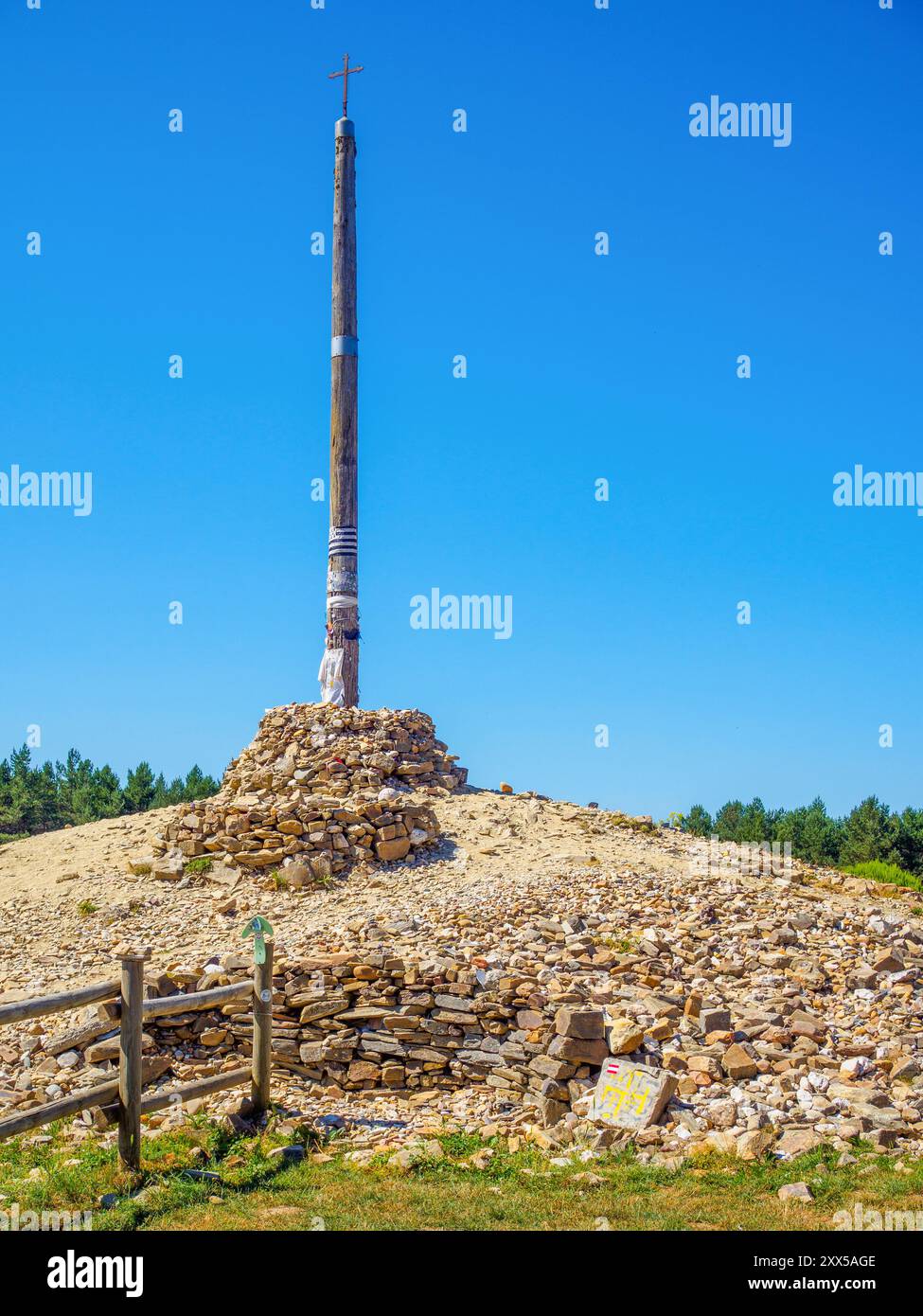 The iconic Cruz de Ferro, a significant landmark on the Camino de Santiago, near Foncebadon ...