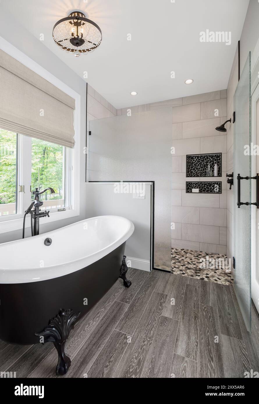 Bathroom with clawfoot bathtub with black exterior and large walk-in ...