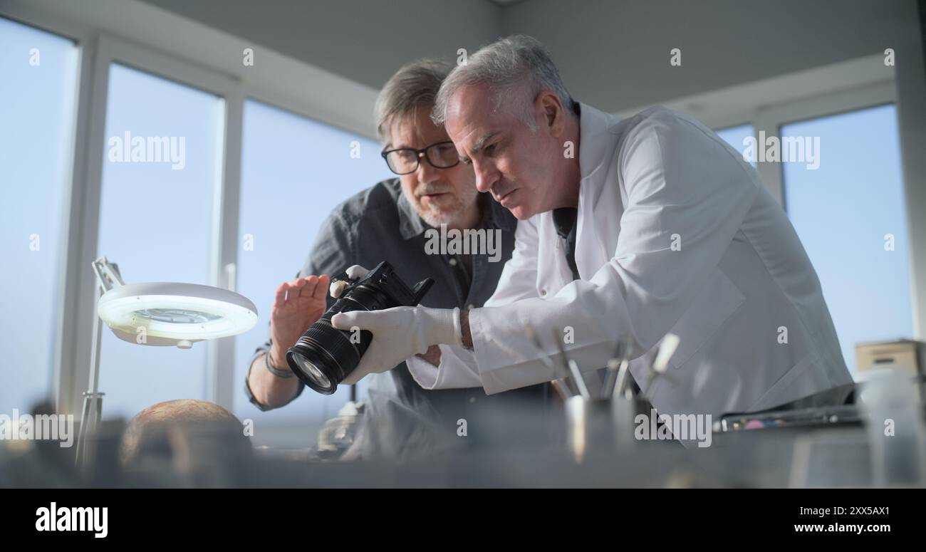 Scientists in modern archaeological lab: Senior paleoanthropologist and ...