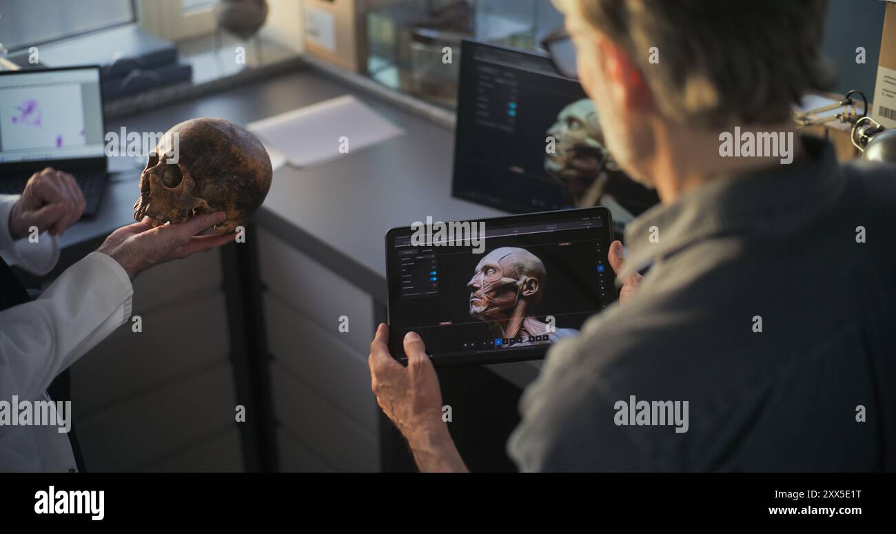 Two archaeologists study fossil skull, create 3D model of prehistoric ...