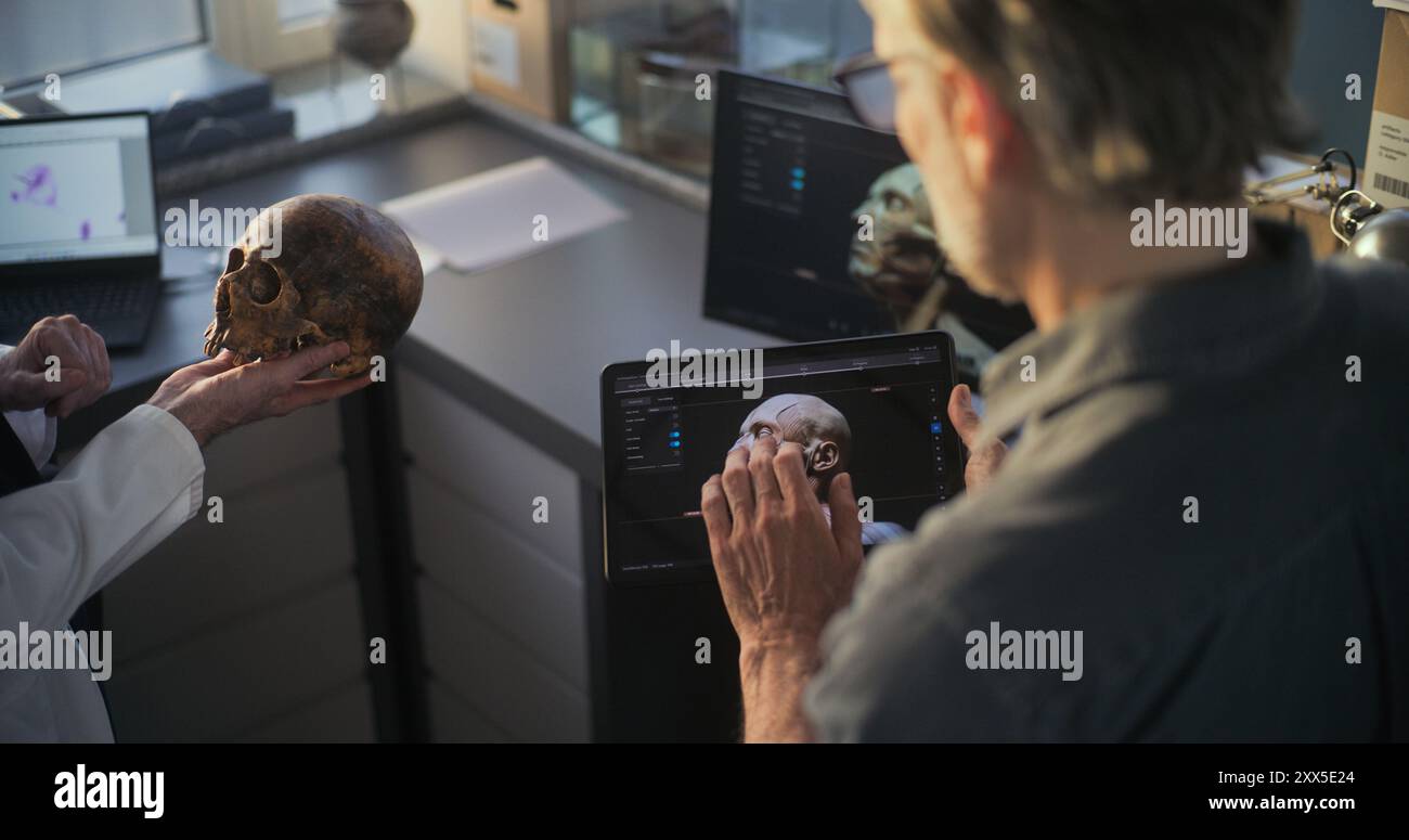 Two archaeologists study fossil skull, create 3D model of prehistoric ...