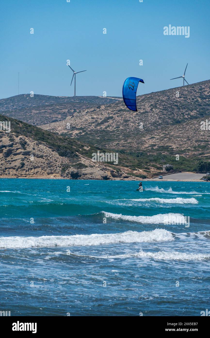 Rhodes (Rodos), Greece. Kitesurfers and wind turbines at the Prasonisi ...