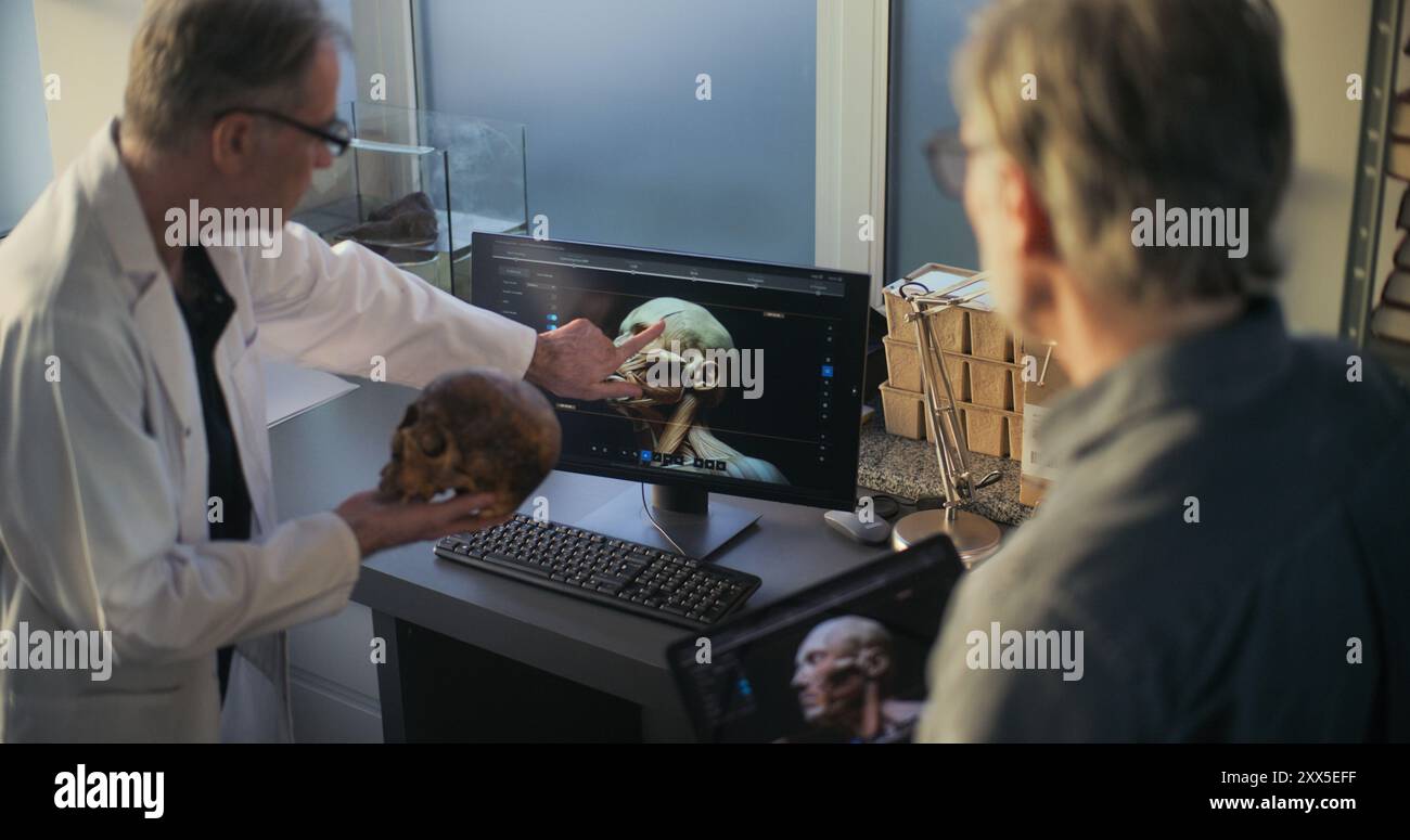 Two archaeologists study fossil skull, create 3D model of prehistoric ...