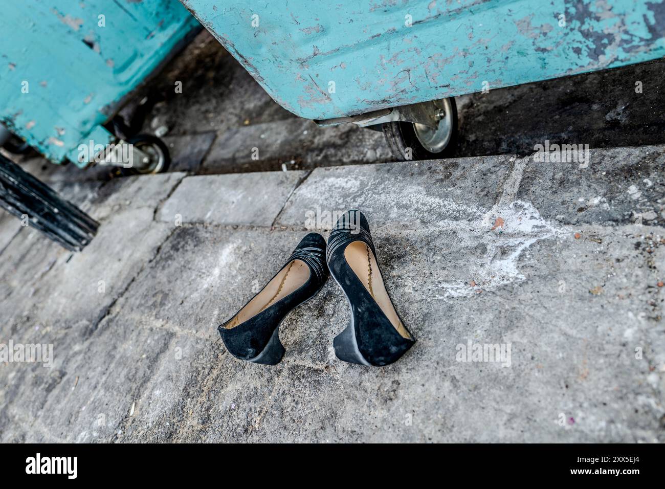 Lost high heels on the sidewalk Stock Photo - Alamy