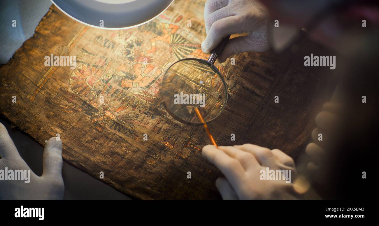 Two scientists examine ancient Egyptian papyrus together in ...