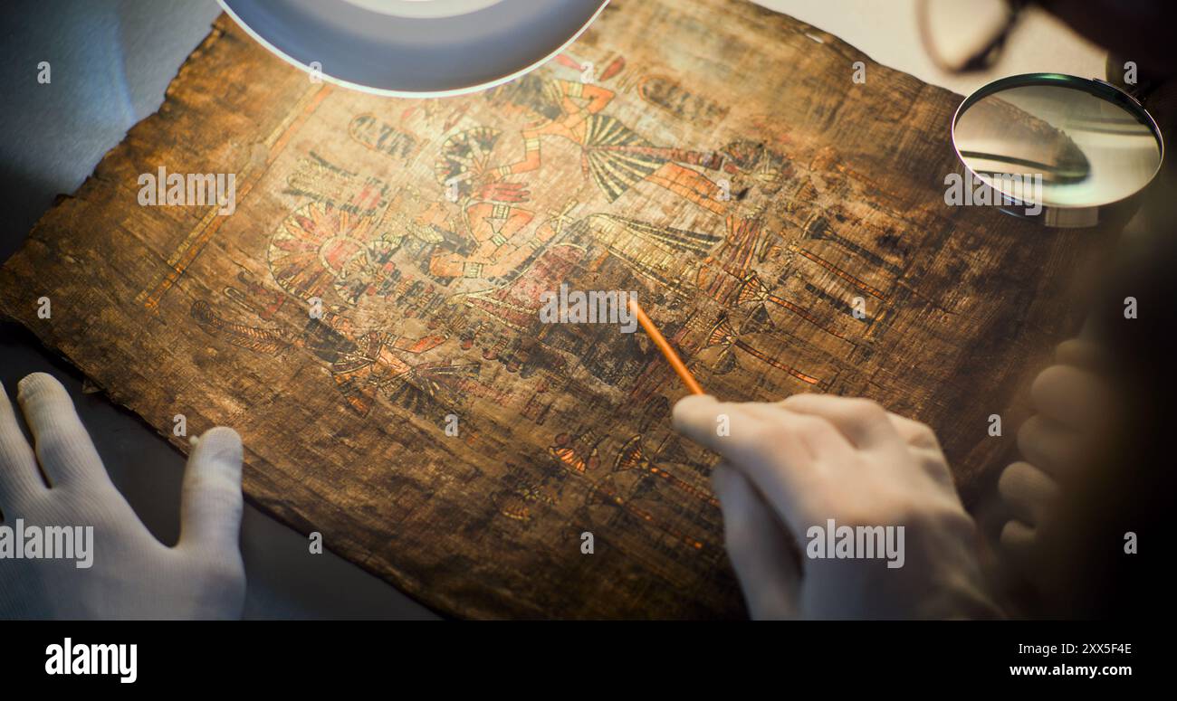 Two scientists examine ancient Egyptian papyrus together in ...