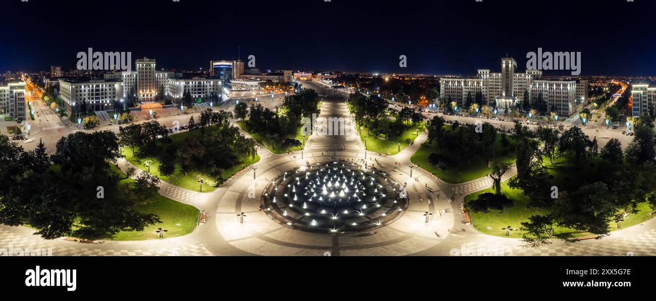 Aerial night wide panorama of illuminated fountain on Freedom Square ...