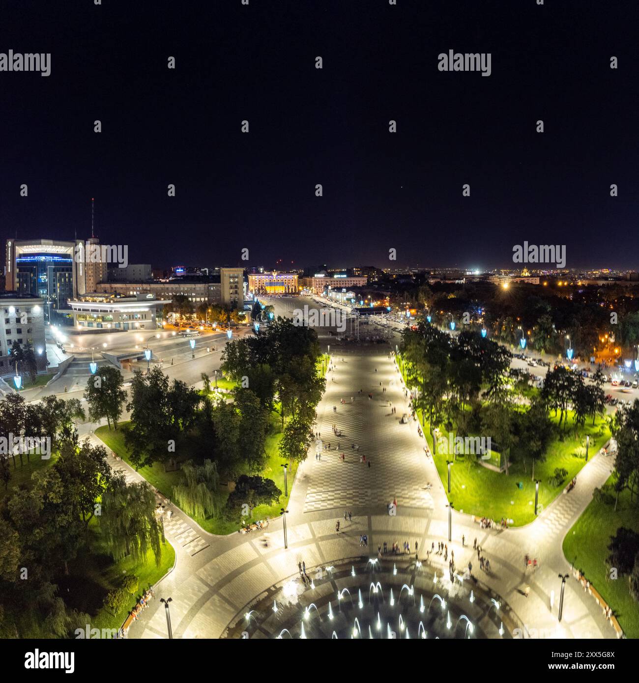 Aerial night view of Freedom Square with fountain and illuminated ...