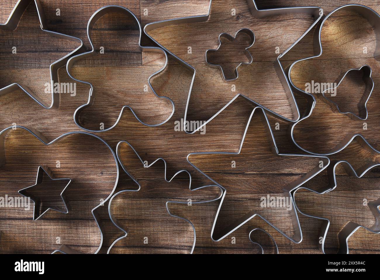 Closeup overhead viewof a group of assorted cookie cutters in various ...