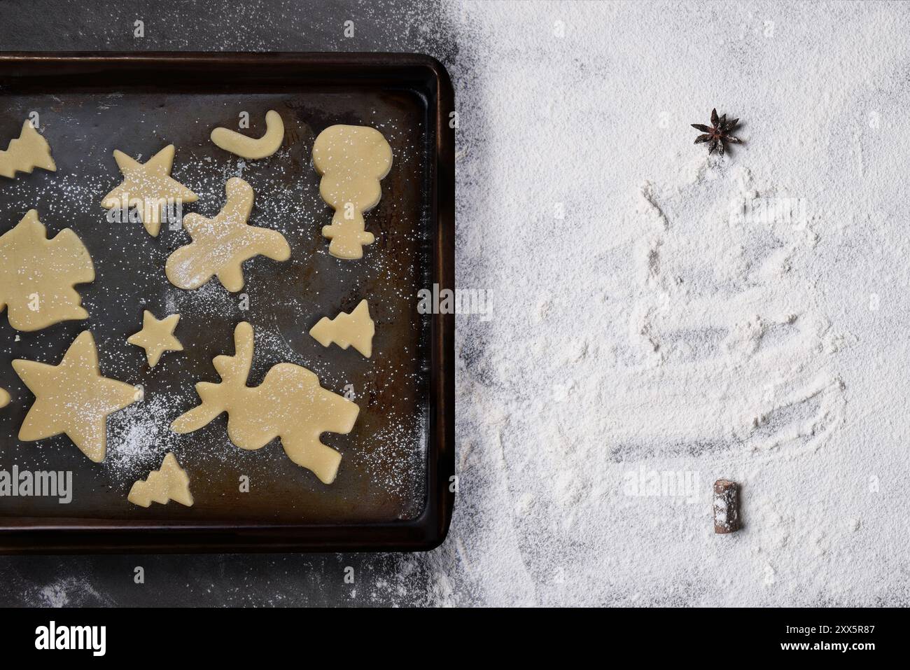 Holiday Baking Concept. Top view of a baking sheet and holiday cookies ...