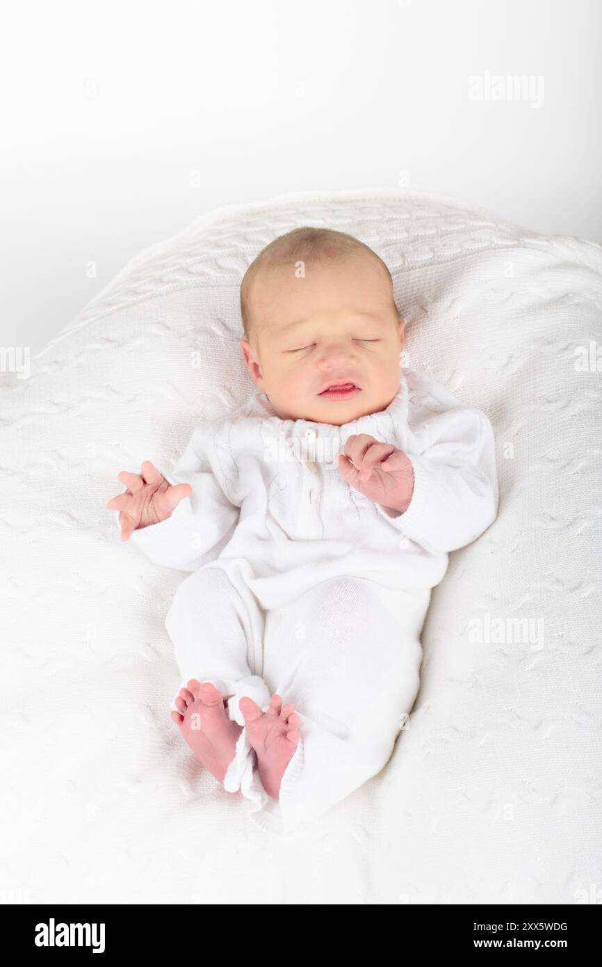 Newborn baby in hospital room. New born child in wooden co-sleeper crib ...