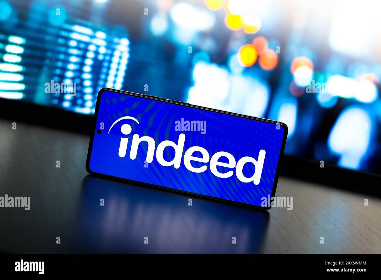 In this photo illustration, the Indeed logo is displayed on a smartphone screen Stock Photo - Alamy