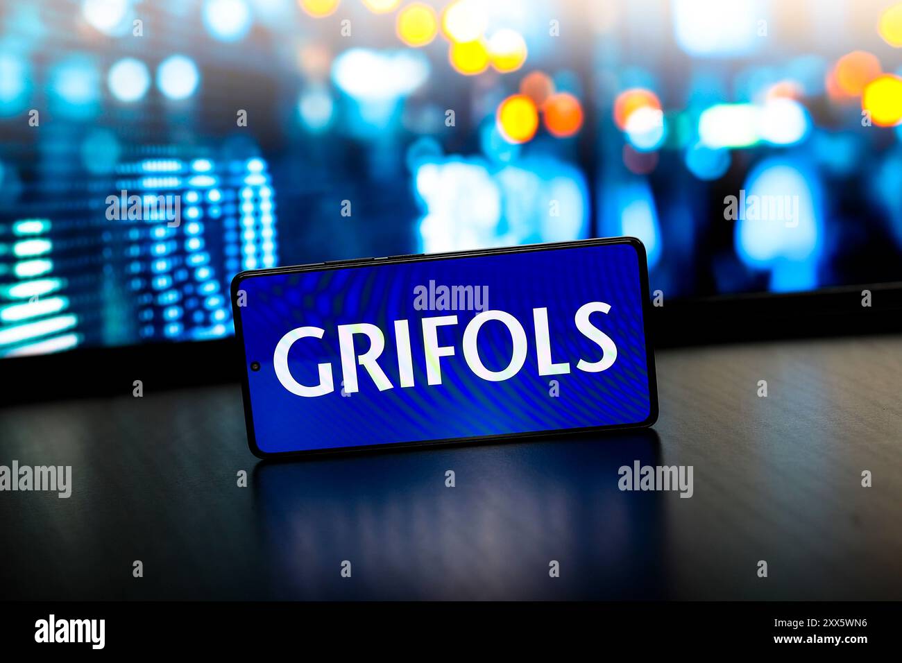 In this photo illustration, the Grifols logo is displayed on a ...